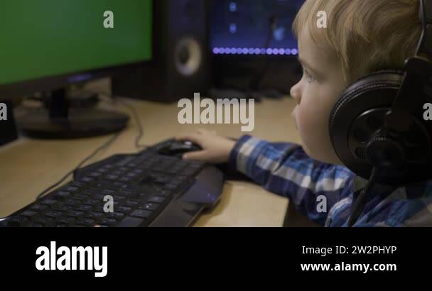 Serious Little Child Studying Learning Watching Internet Videos. Boy ...