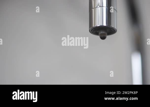 Kitchen faucet with dripping water, close-up. Leaky plumbing faucet ...