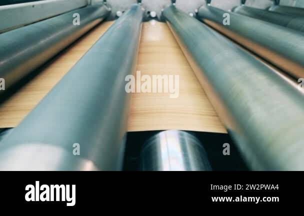 Rolling conveyor with a metal facing plate going through it Stock Video ...
