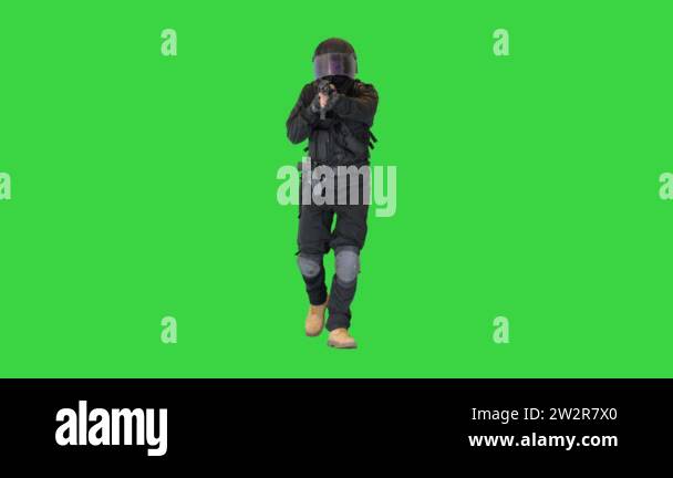 Masked Squad Member of Armed SWAT Police Walking And Aming With a Rifle ...