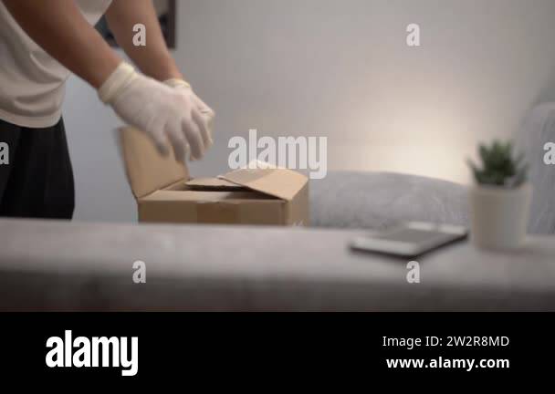 Asian male unpacking take away Food box, grocery online purchase ...