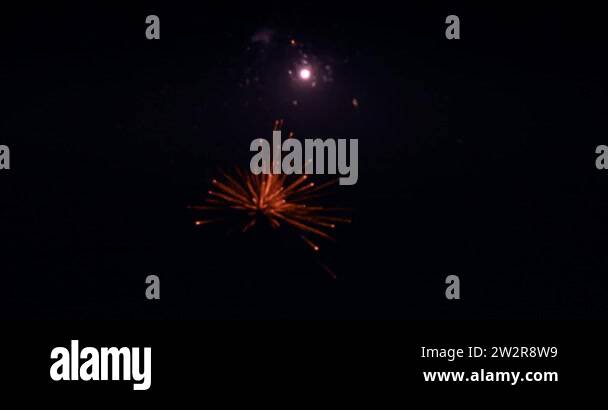 Golden big shiny fireworks with bokeh lights in the night sky. Glowing ...