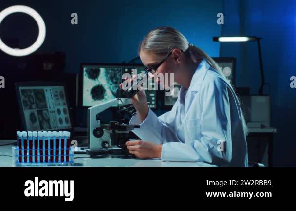 Female scientist working in modern lab. Doctor making microbiology ...