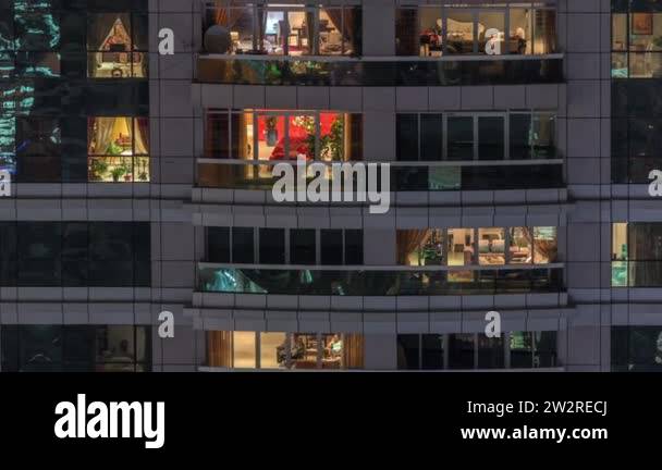 Night view of exterior apartment building timelapse. High rise ...