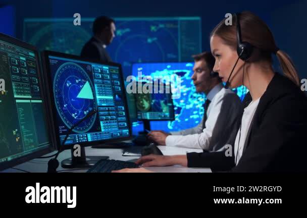 Workplace of the air traffic controllers in the control tower. Team of ...