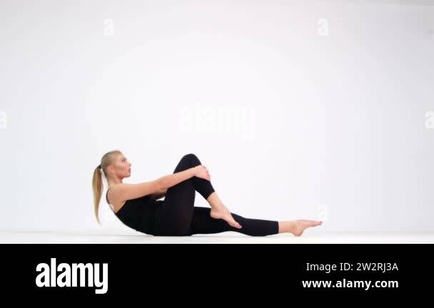 Blonde bent female jazz dancer performance with arms swinging in s ...