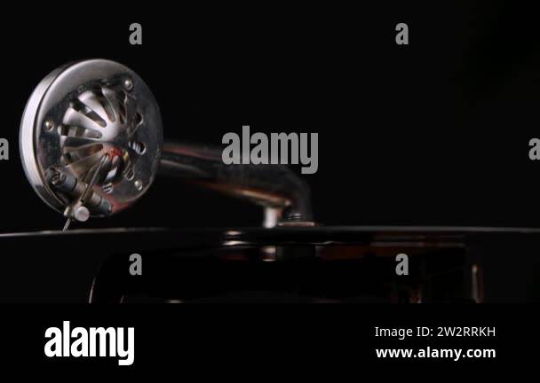 Large needle of a vintage gramophone on rotates vinyl record. Vintage ...