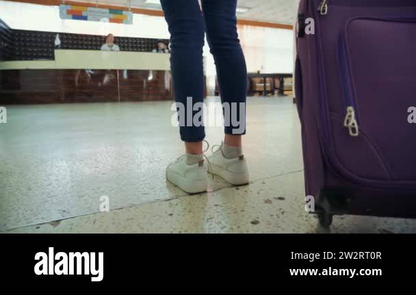stepping feet,A woman with a large baggage in her hand is dragging her ...