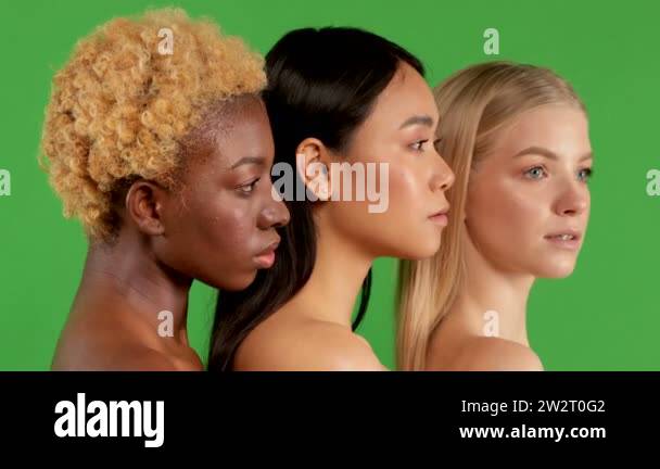 Three young women of different races, with shouldered shoulders ...