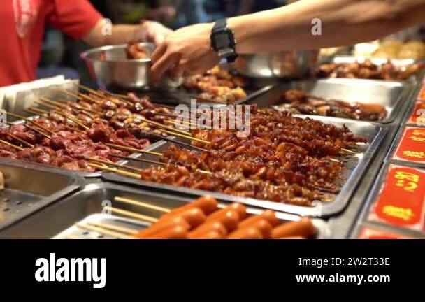 4k Asian Vendor selling delicious local food grilled barbecue assorted ...