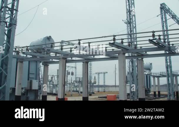 High voltage substation 110 kV with tall pylons and hog voltage ...