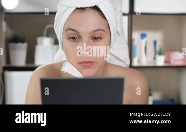 Girl Rubs Her Face Attractive Woman In Bathroom With White Towel On