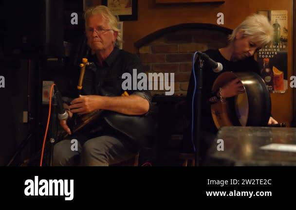 KILLORGLIN, COUNTY KERRY, IRELAND - AUGUST, 2019: Irish musician couple ...