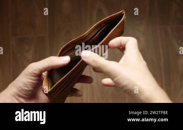 Man bankrupt arrears showing empty wallet with no money. Poverty ...