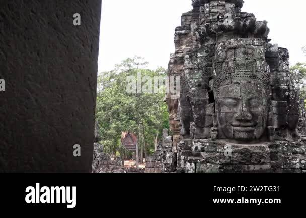 4K, Face towers depicting Bodhisattva Avalokiteshvara. Smiling faces ...