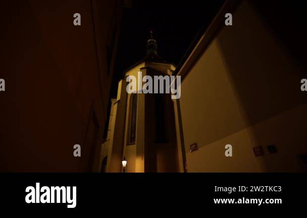light from street lights in the old town and The Church of St. Hatal in ...
