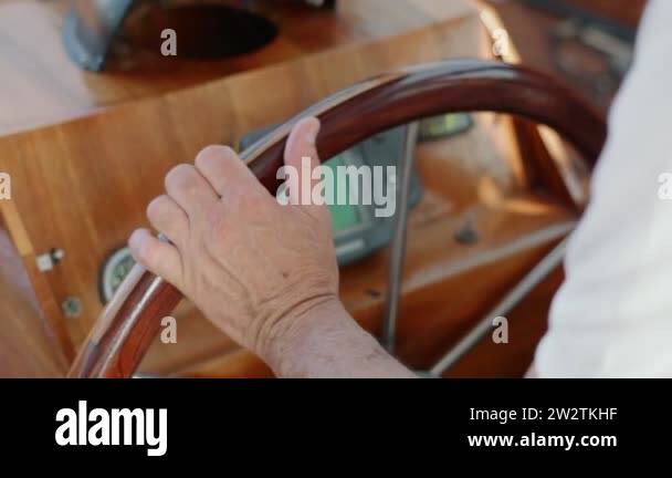 Captain Turns Wooden Steering Wheel On A Ship.Steering Wheel Of ...