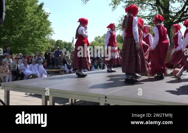 girls in national dress dance in circle and people audience. 4K Stock ...