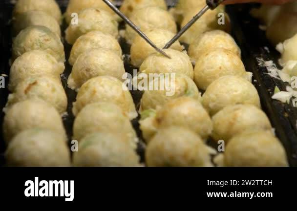 Japanese vendor prepare a Takoyaki on hot pan food Japan. Process to ...