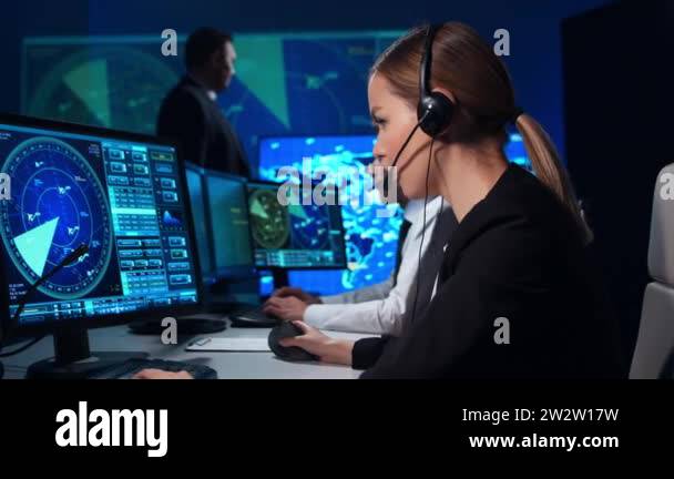 Workplace of the air traffic controllers in the control tower. Team of ...