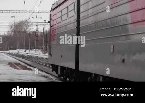 The locomotive pulls the freight train with wagons. Rail freight Stock ...