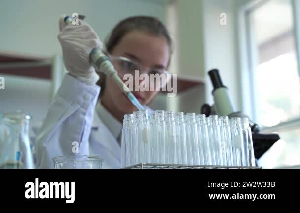 Female scientists use pipette dropper samples to test tubes.To conduct ...