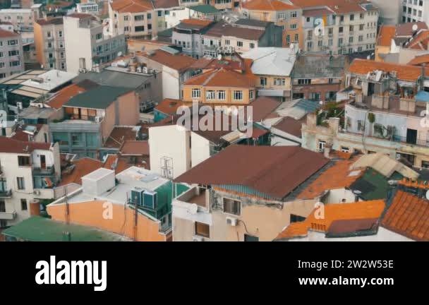 Beautiful red roofs with many satellite dishes and air conditioning ...