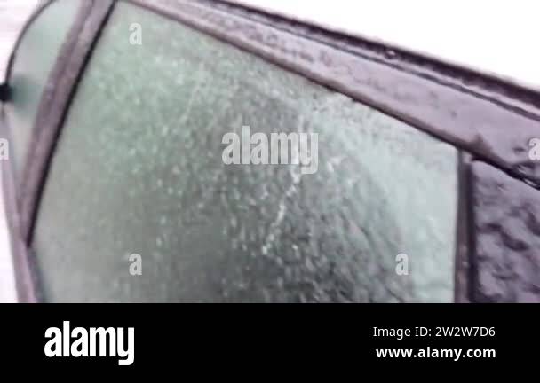 Europe, Ukraine, Kiev - December 2020: Opening of the icy car. The car ...