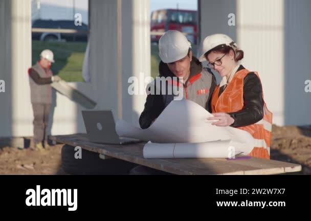 architect and engineer viewing a building project of an indoor ...