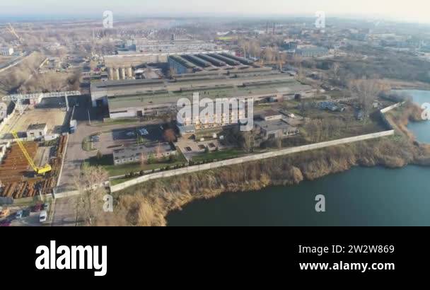 Large plant near the lake, beautiful nature. Industrial buildings top ...
