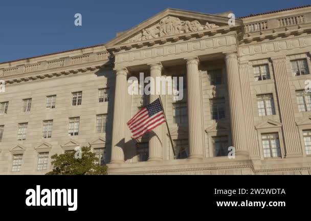 USA flag on facade of US Commerce building in Washington DC Stock Video ...