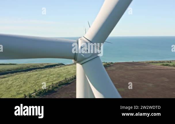 Close up of a wind turbine. Aerial top view wind turbine, moving above ...