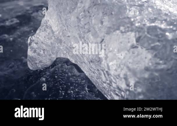 Block of transparent ice. Clear ice lump on the surface of a frozen ...