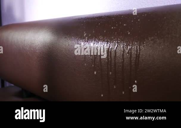 Cleaning and disinfection in office client area. Worker spraying with ...