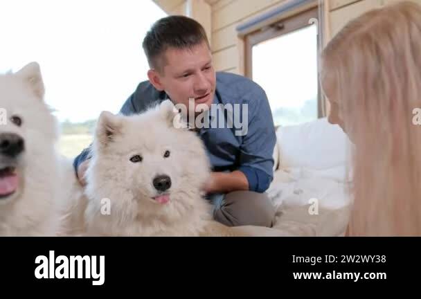 Young Caucasian family couple with baby daughter in a small modern ...