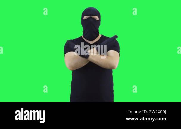 A man in a balaclava shows the end,green screen background Stock Video ...