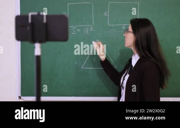 Online schooling, e-learning. Female teacher is holding online lesson ...