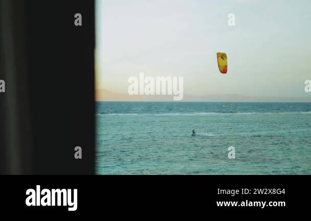 People Kite surfing in beautiful clear water in Dahab Egypt point of ...