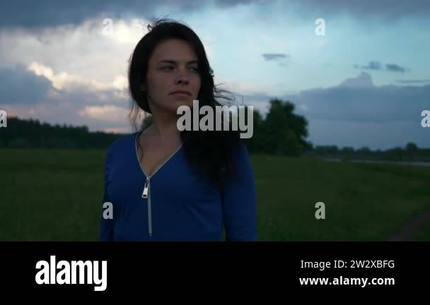 Rain Drops Falling on Beautiful Woman Walking Along Rural Road in Grass ...
