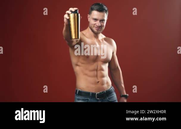 Attractive bodybuilder guy with protein shake. Portrait of a sportsman ...
