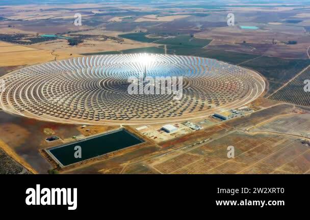 Modern solar power station with tower in aerial view, Concentrated solar power tower, solar farm ...