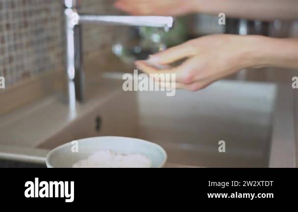 Young woman take white food salt rub in water using alternative to ...