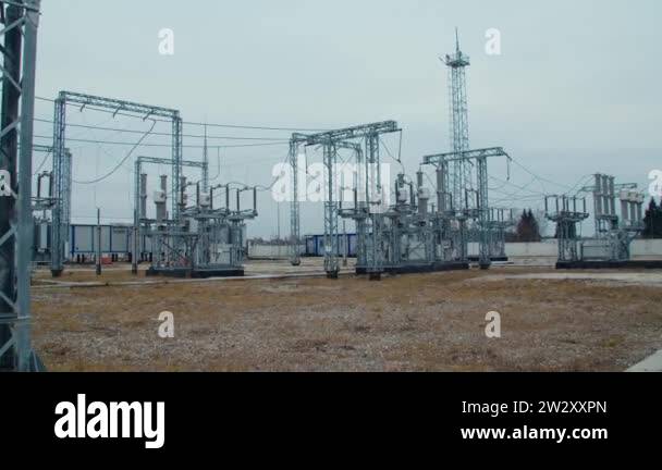 High voltage substation 110 kV with tall pylons and hog voltage ...