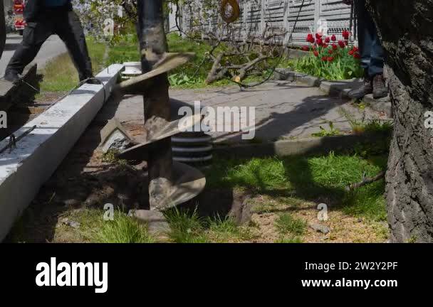 Tracer tractor with auger for soil drilling for piles installation ...