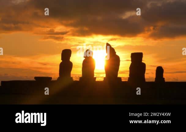 SUN FLARE: Stunning view of silhouettes of moai sculptures at stunning ...