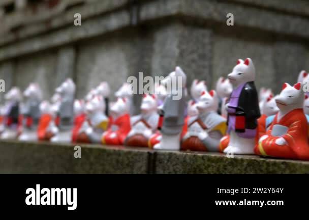 4K, Hundreds of small statues of lucky foxes in the famous Shinto ...