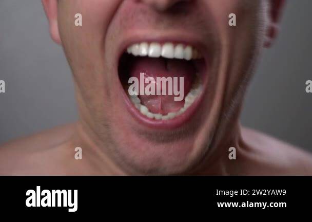Zoom effect. Man with angry facial expression is screaming out loud ...