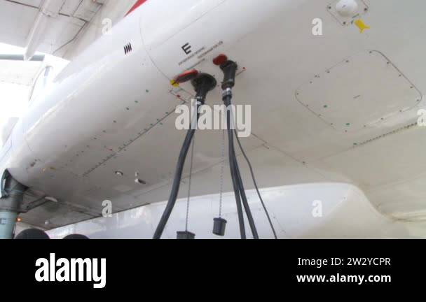 Airport airplane crew refueling aircraft on airline by technical staff ...
