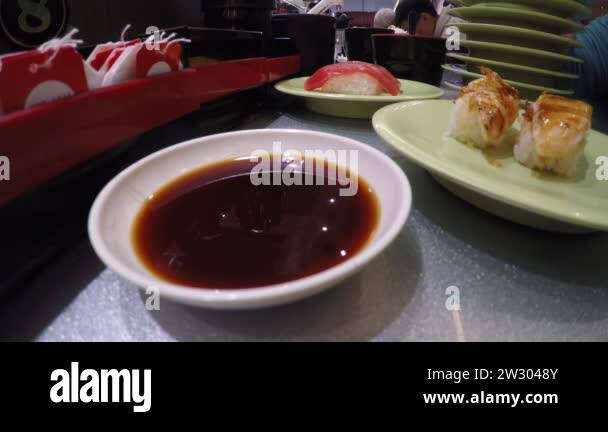 4K, People prepare and eat Sushi in Japan Restaurant. Shushi is a food ...