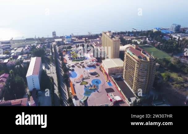 High-rise buildings located on coast on background of sea. Clip. Top ...